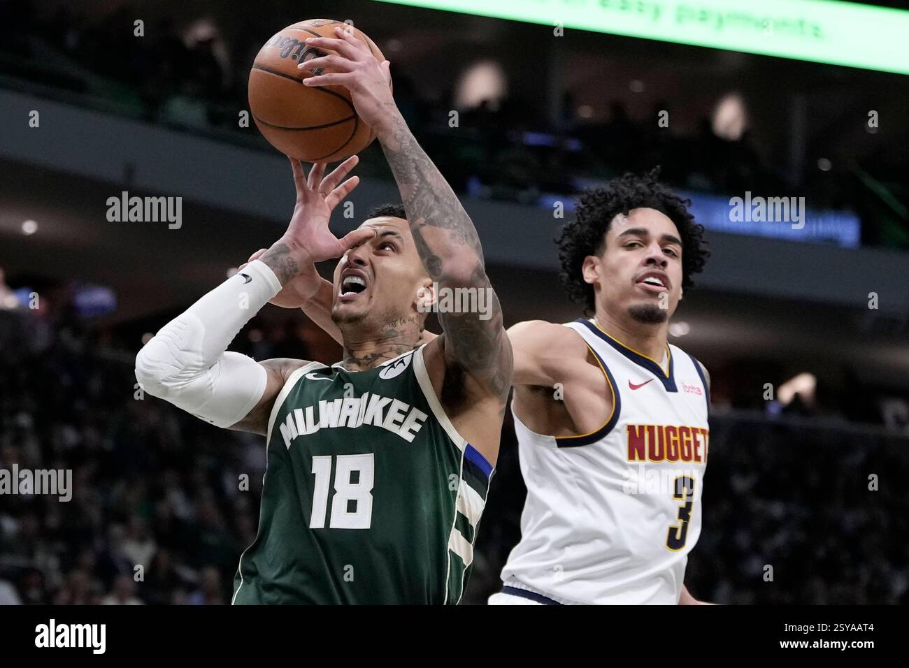 Denver Nuggets' Julian Strawther knocks the ball from Milwaukee Bucks ...