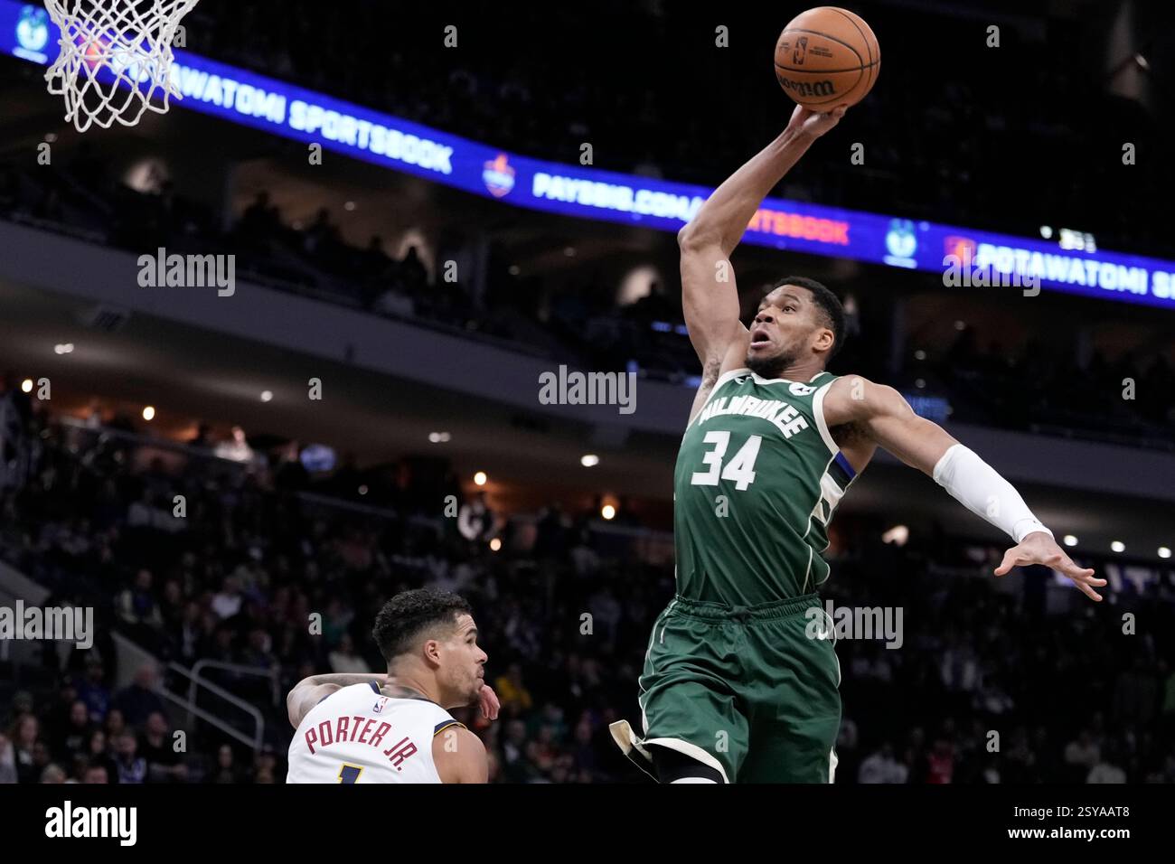 Milwaukee Bucks' Giannis Antetokounmpo dunks past Denver Nuggets ...