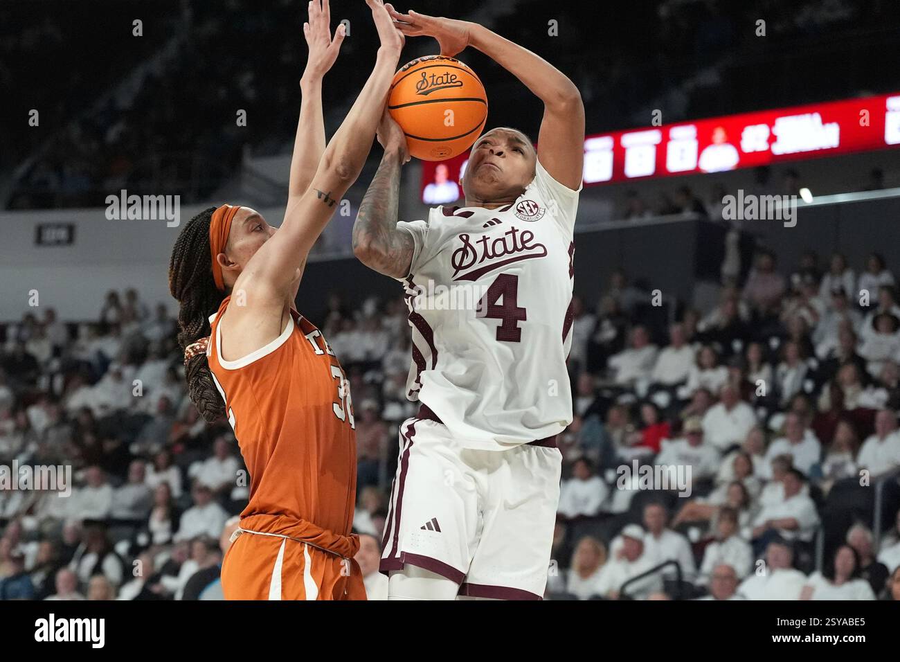 Texas guard Ndjakalenga Mwenentanda (32) blocks a shot attempt by ...