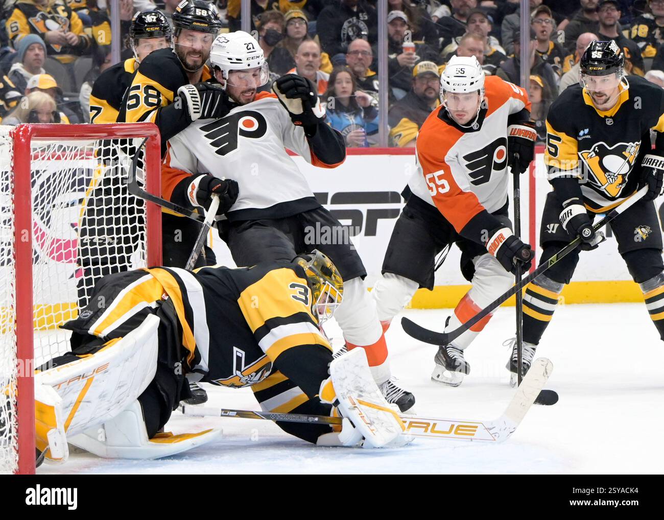 Pittsburgh Penguins defenseman Kris Letang (58) pulls Philadelphia ...
