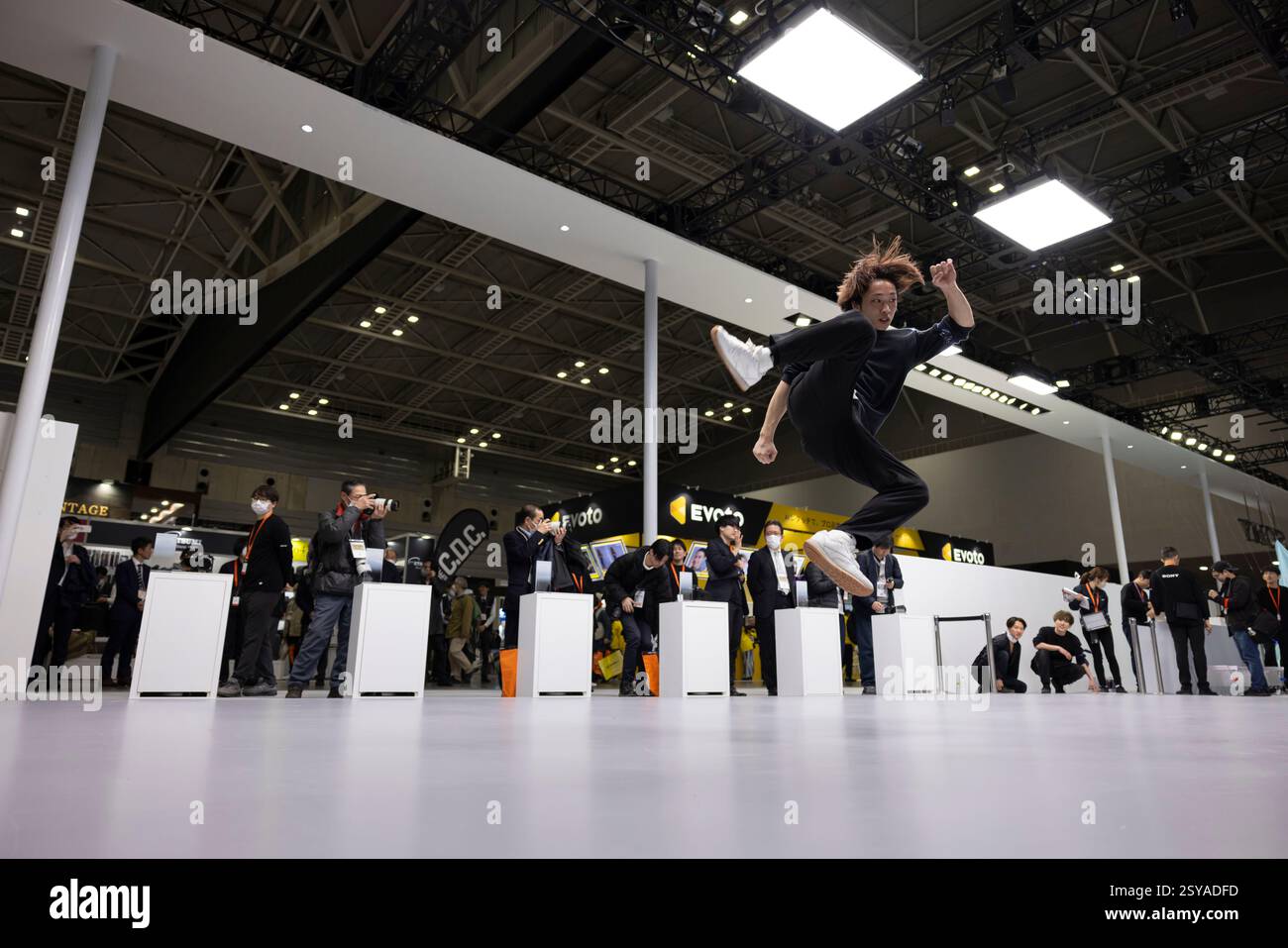 Breakdancer performs his routine for visitors inside the SONY ...