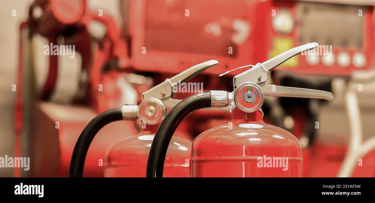 The red fire extinguisher is ready for use in case of an indoor fire ...