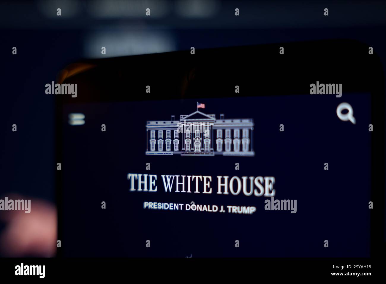A smartphone screen displays the White House website and the official ...