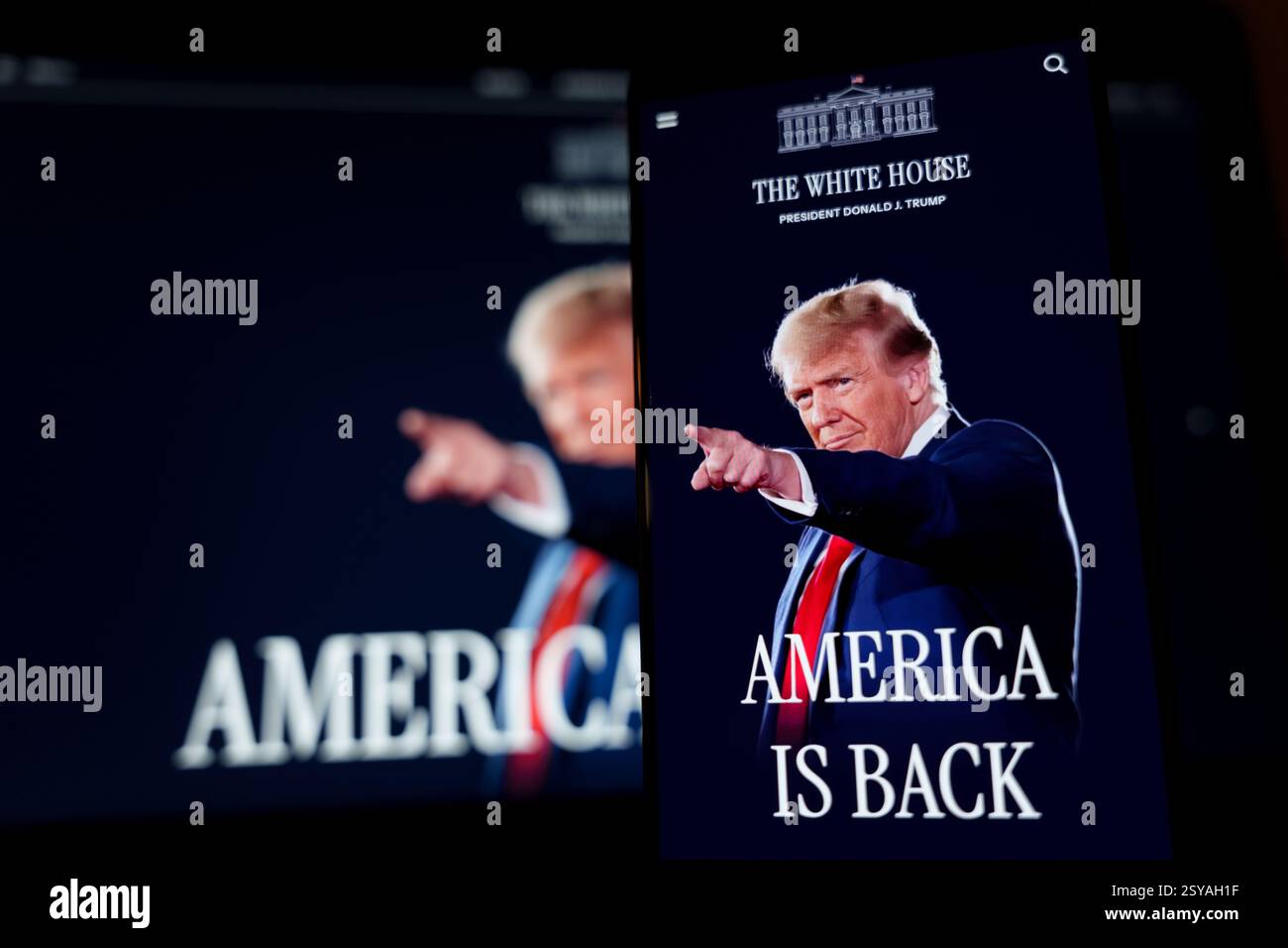 A smartphone screen displays The white house website with an image of ...