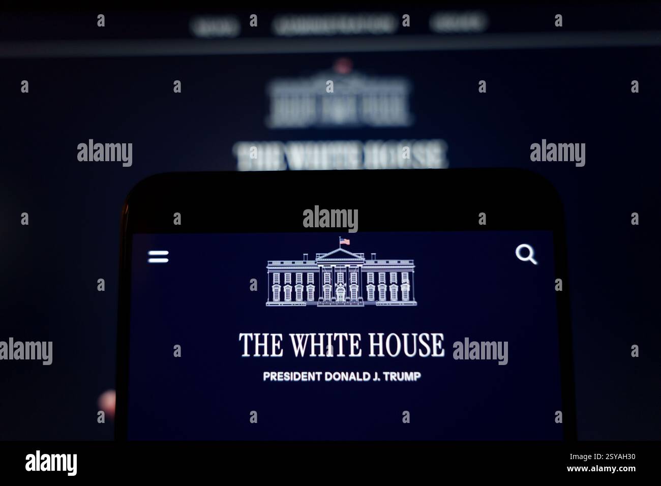 A smartphone screen displays the White House website and the official ...