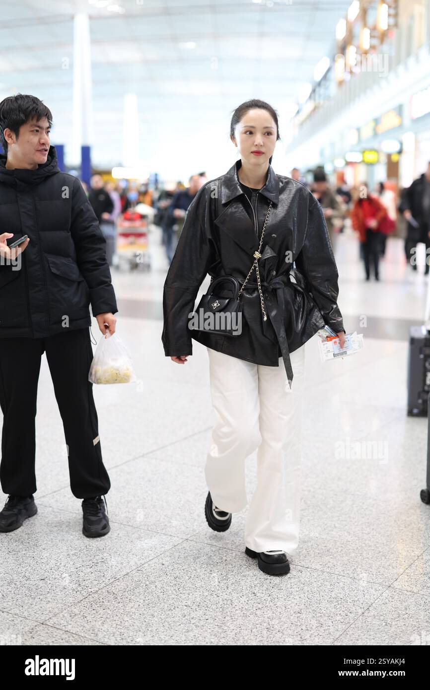 Chinese actress and singer Dong Xuan appears at the airport in Beijing ...