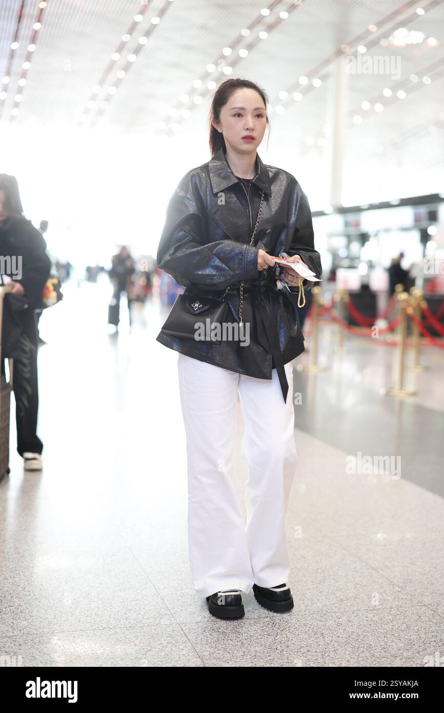 Chinese actress and singer Dong Xuan appears at the airport in Beijing ...