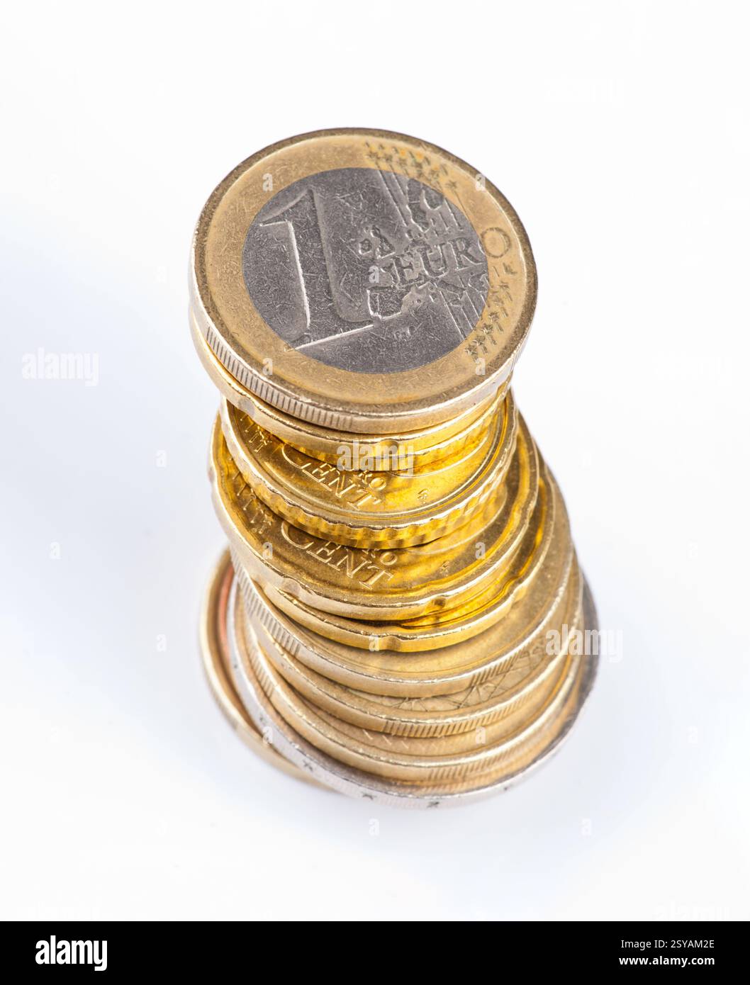Vertical stack of various euro coins, including one euro and other ...