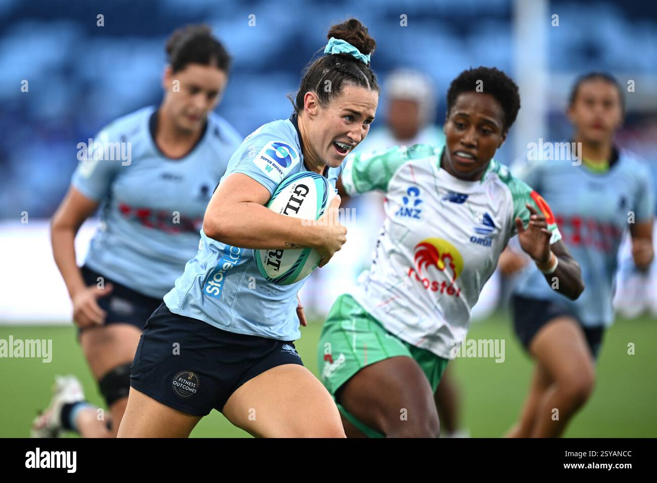 Maya Stewart of the Waratahs makes a break to score a try during the ...