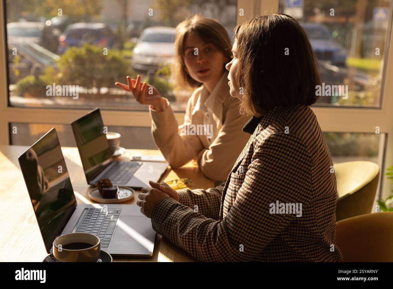 Two diverse women talking discussion hi-res stock photography and ...