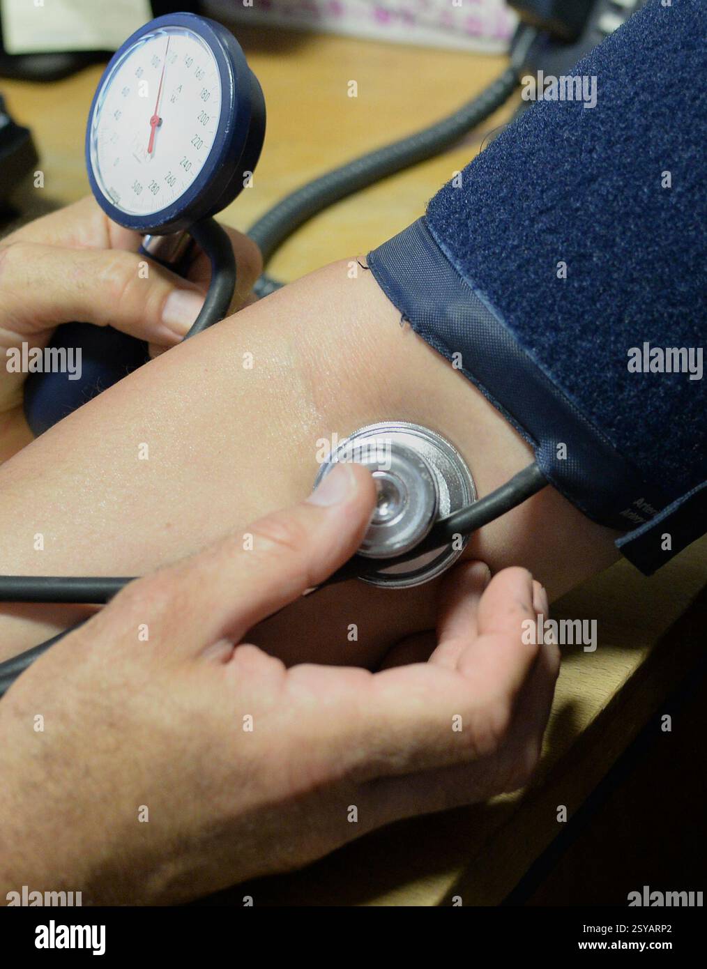 File photo dated 10/09/14 of a doctor checking a patient's blood ...