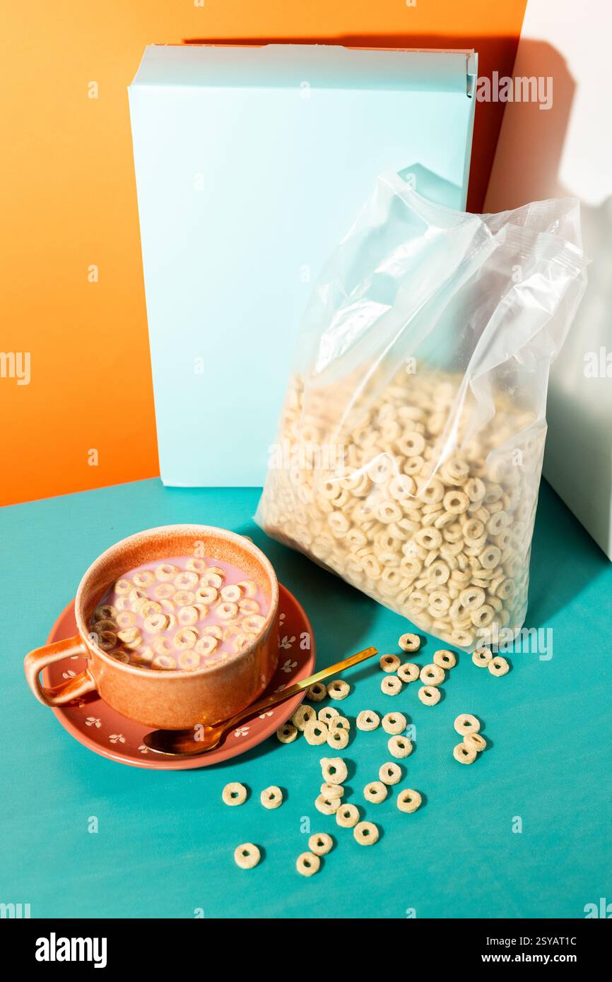 Inviting breakfast scene featuring a cup filled with milk and cereal ...
