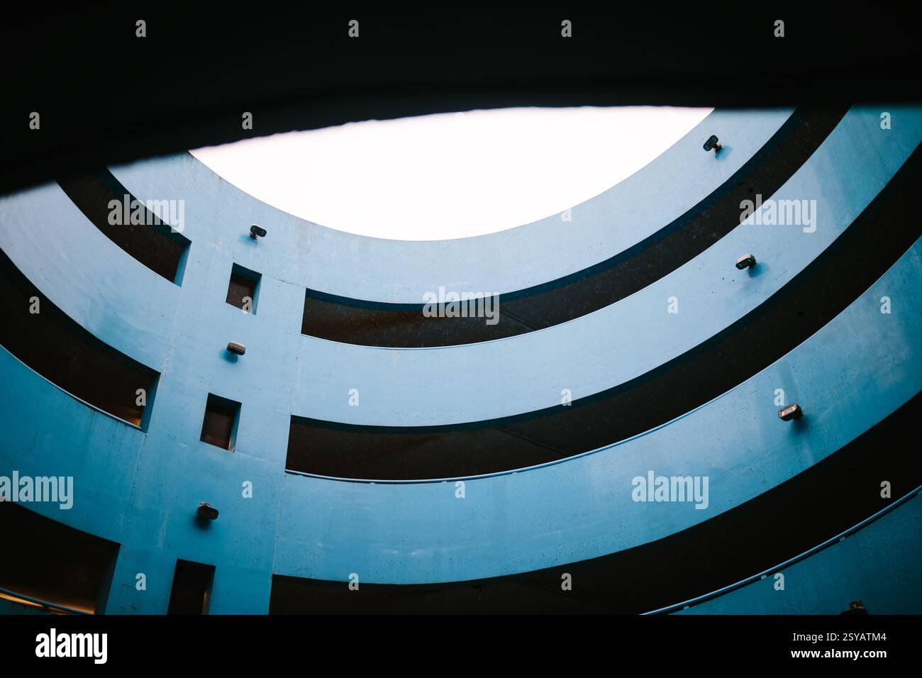 Architectural photograph of a blue parking lot building featuring ...