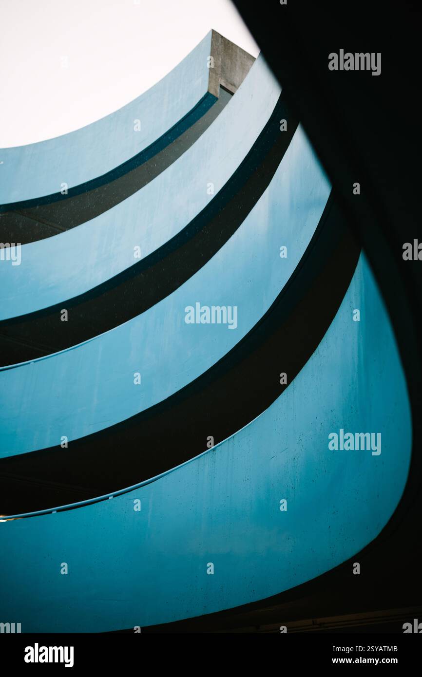 Architectural photograph of a blue parking lot building featuring ...