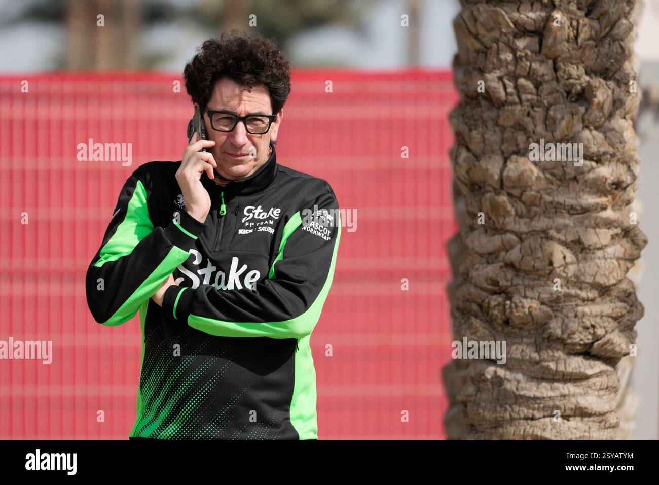 Kick Sauber team principal Mattia Binotto talks on the phone during a ...