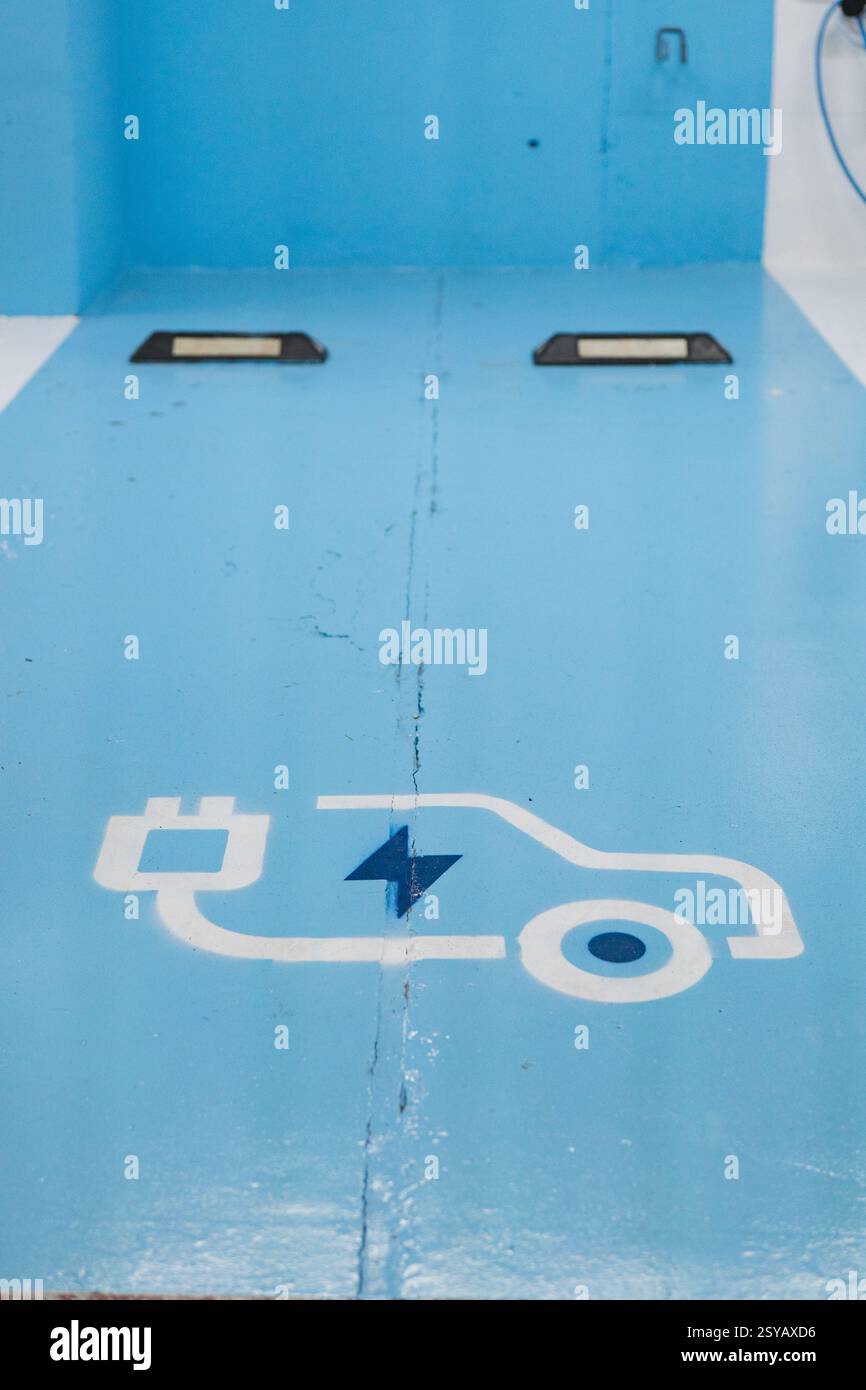 Close-up view of an electric vehicle charging station symbol depicted ...