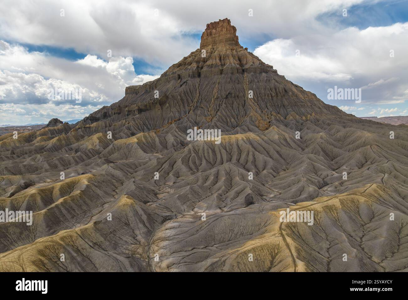 A striking desert mesa rises prominently against a backdrop of ...