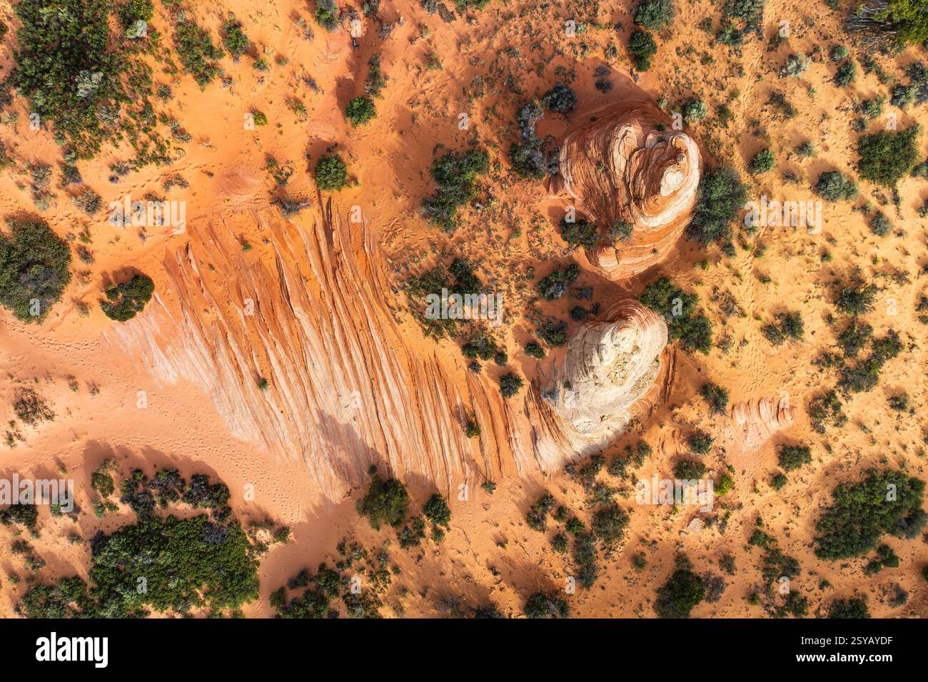 Aerial shot showcases a desert landscape with unique rock formations ...