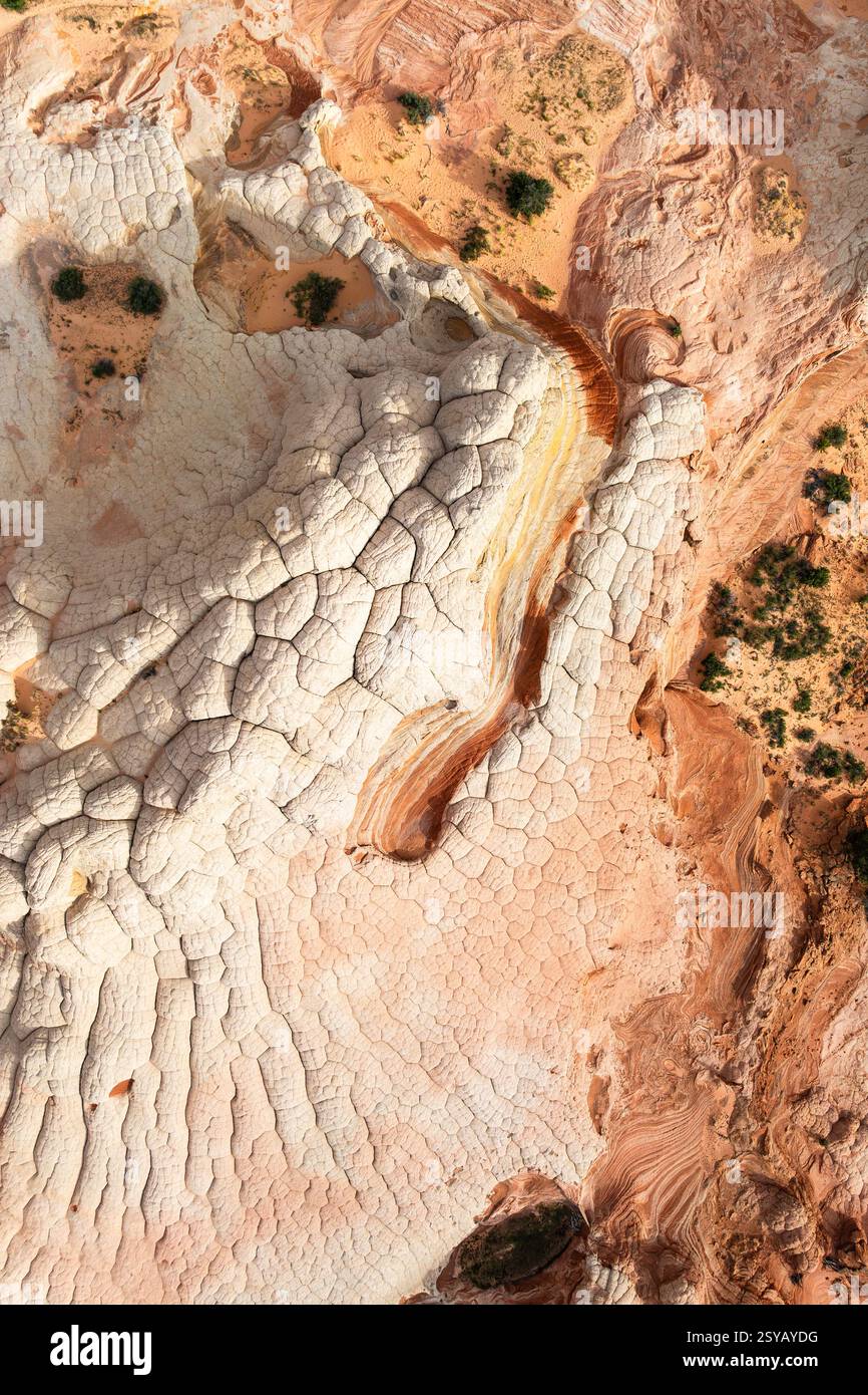 Aerial view capturing a desert landscape with rock formations ...