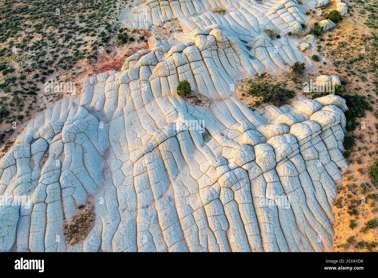 Aerial view of stunning white rock formations resembling waves in an ...