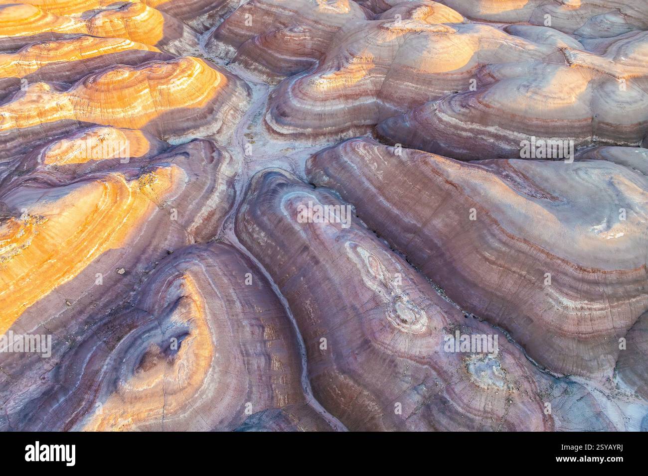 An aerial view of the unique golden hues and layered formations of ...