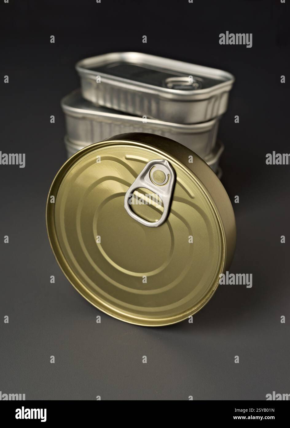 A detailed close up of a stack of cylindrical food cans with convenient ...
