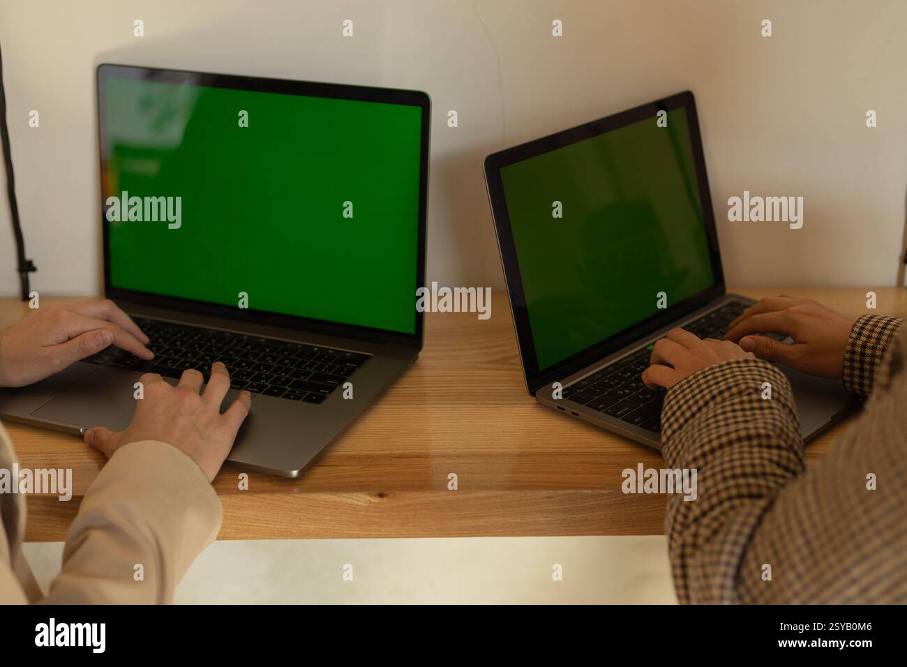 Laptops on desk office hands hi-res stock photography and images - Alamy