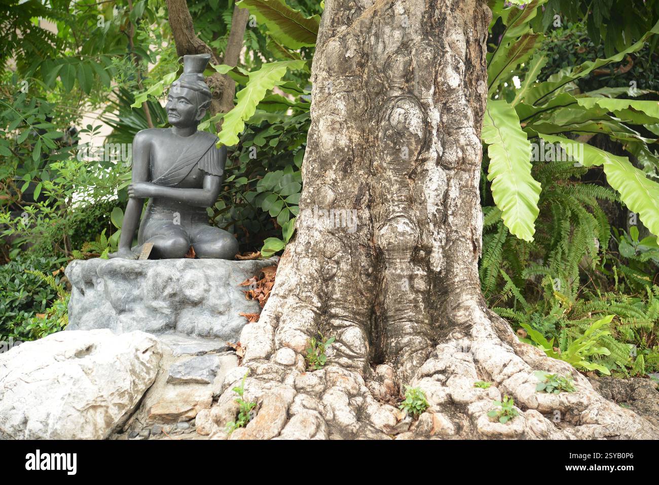 Statue of a hermit performing a massage therapy pose at Wat Phra ...
