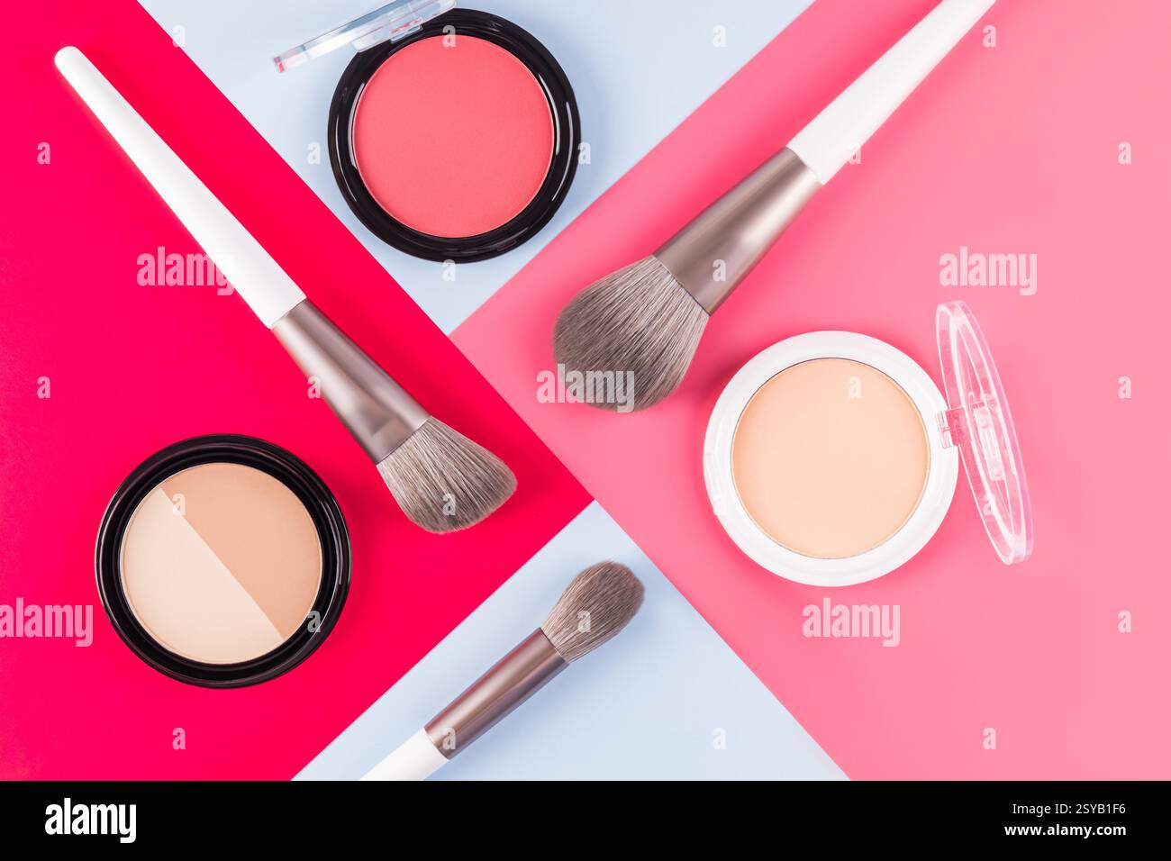 Aesthetic arrangement of makeup brushes and powder compacts on ...