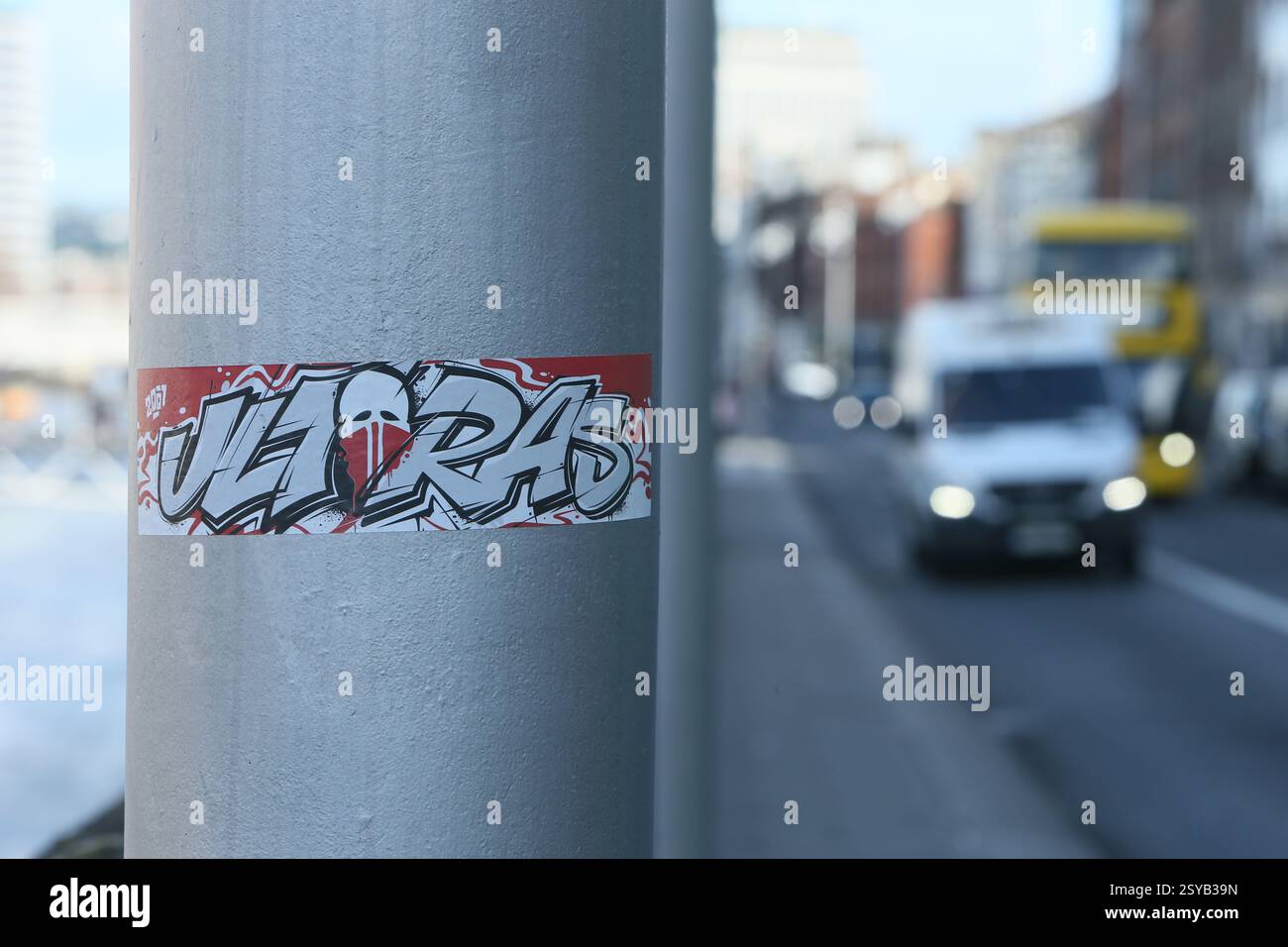 Dublin, Ireland - 25th February 2025 - A red and white sticker with ...