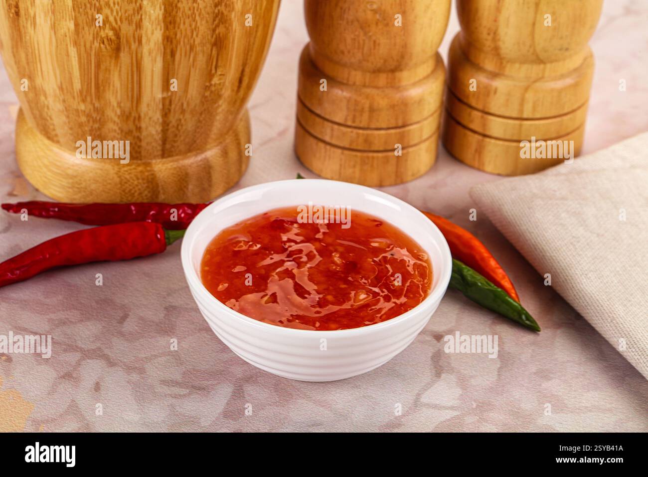 Sweet and sour chili sauce with pineapple pieces Stock Photo - Alamy