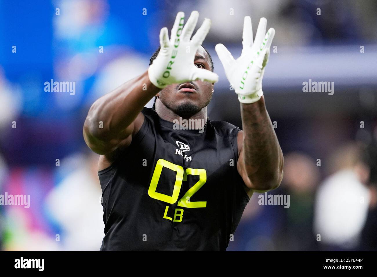 Oregon linebacker Jeffrey Bassa runs a drill at the NFL football ...