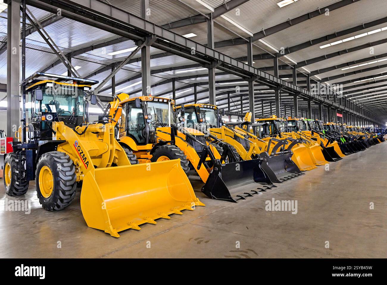 Products waiting to be shipped are arranged in a workshop of a loader ...