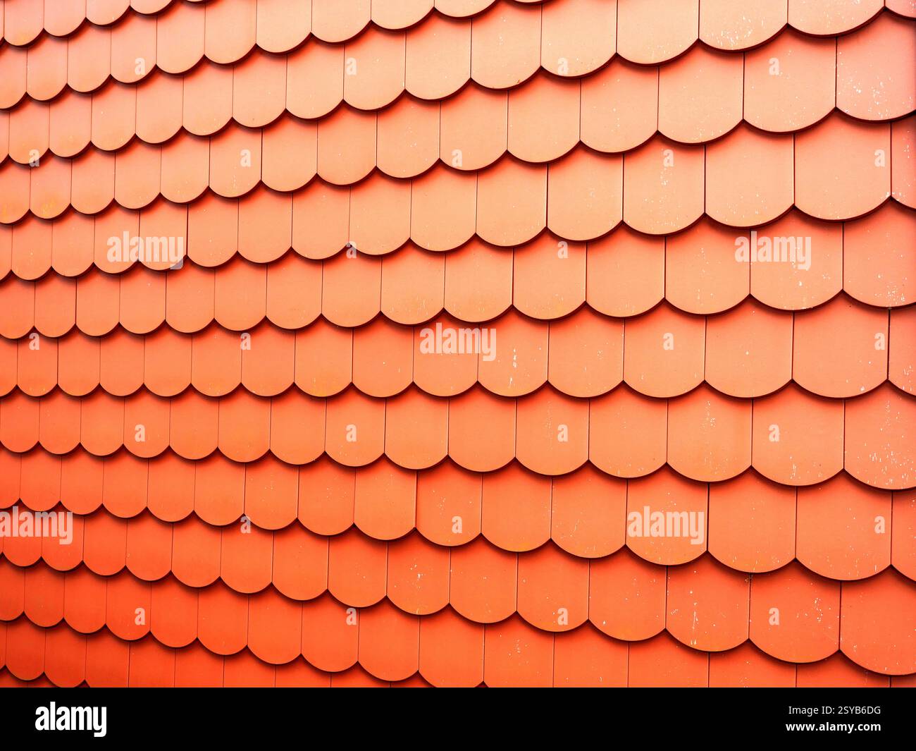 Red clay shingles as facade cladding provide inspiring textures ...