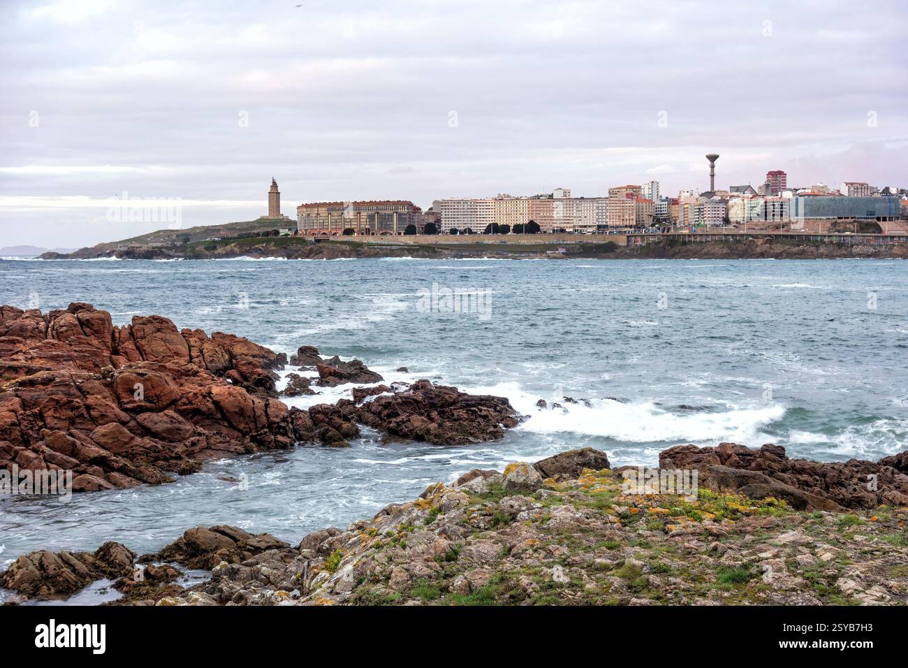 Riazor beach bay in the Spanish city of A Coruña and the Hercules tower ...