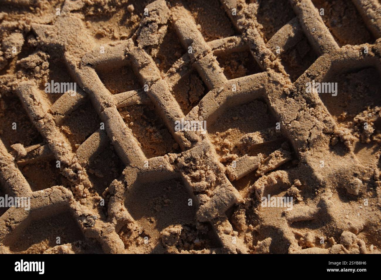 Mark of truck on the sand. Wheel tread mark on a dirt road. The trail ...