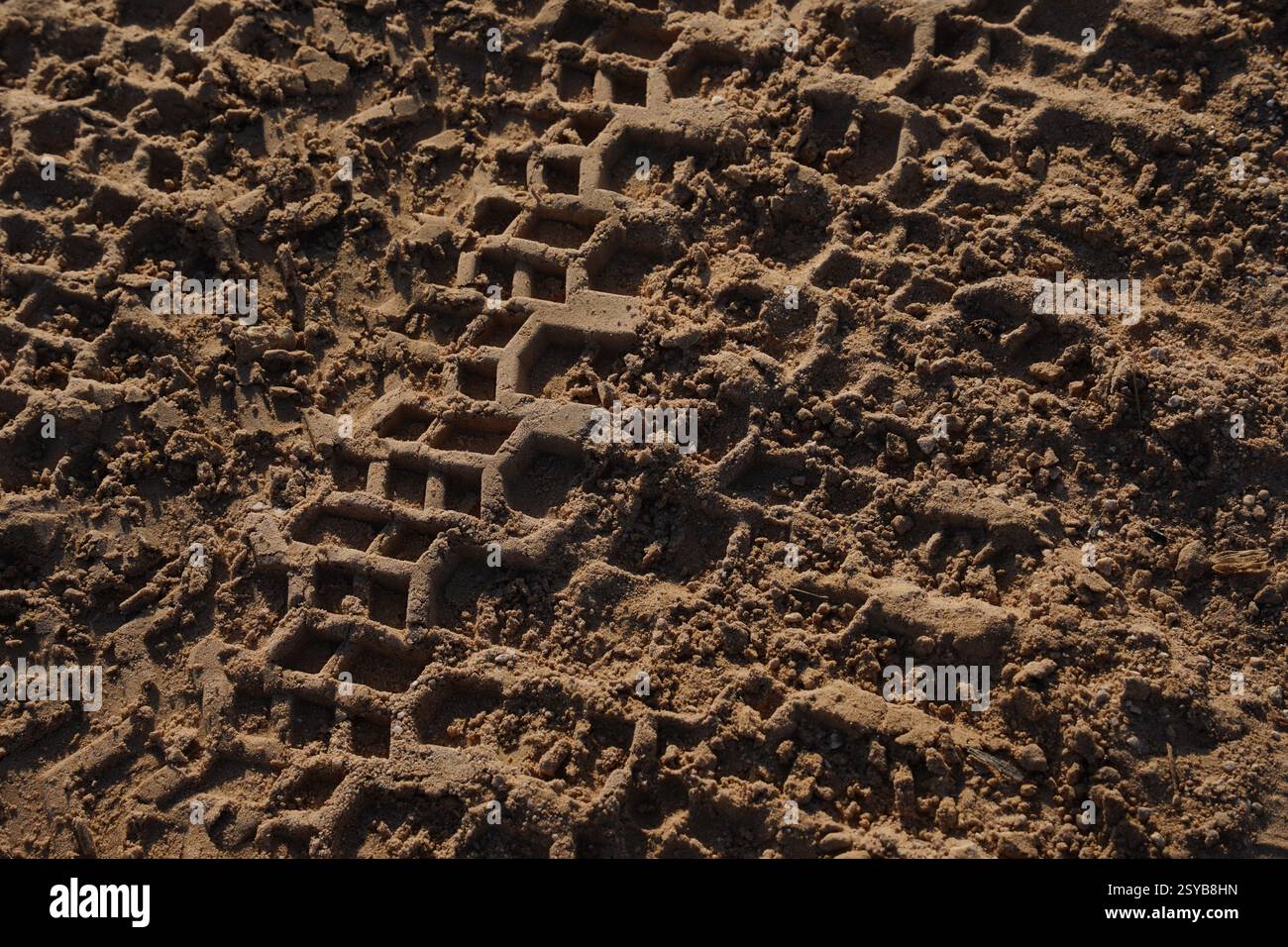 Mark of truck on the sand. Wheel tread mark on a dirt road. The trail ...