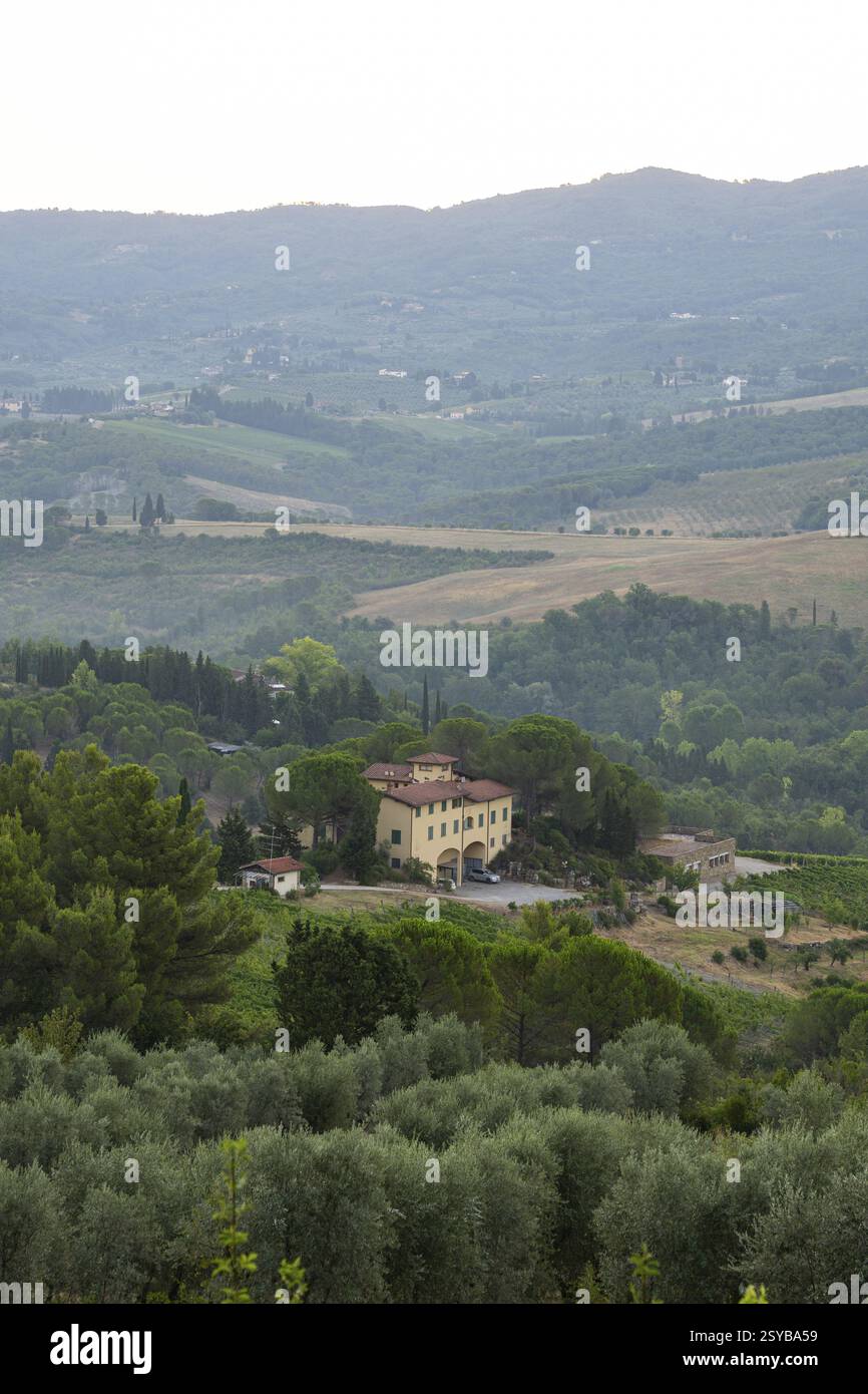 Tuscan landscape at sunrise, country estate with a farm house ...