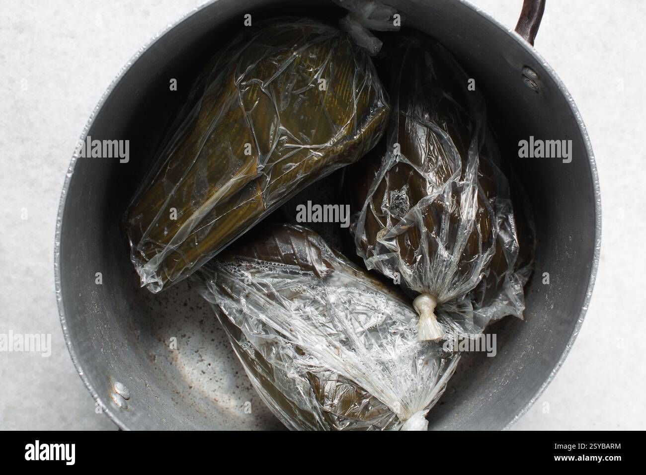 Overhead of moi moi in leaf on a plate, top view of nigerian bean ...