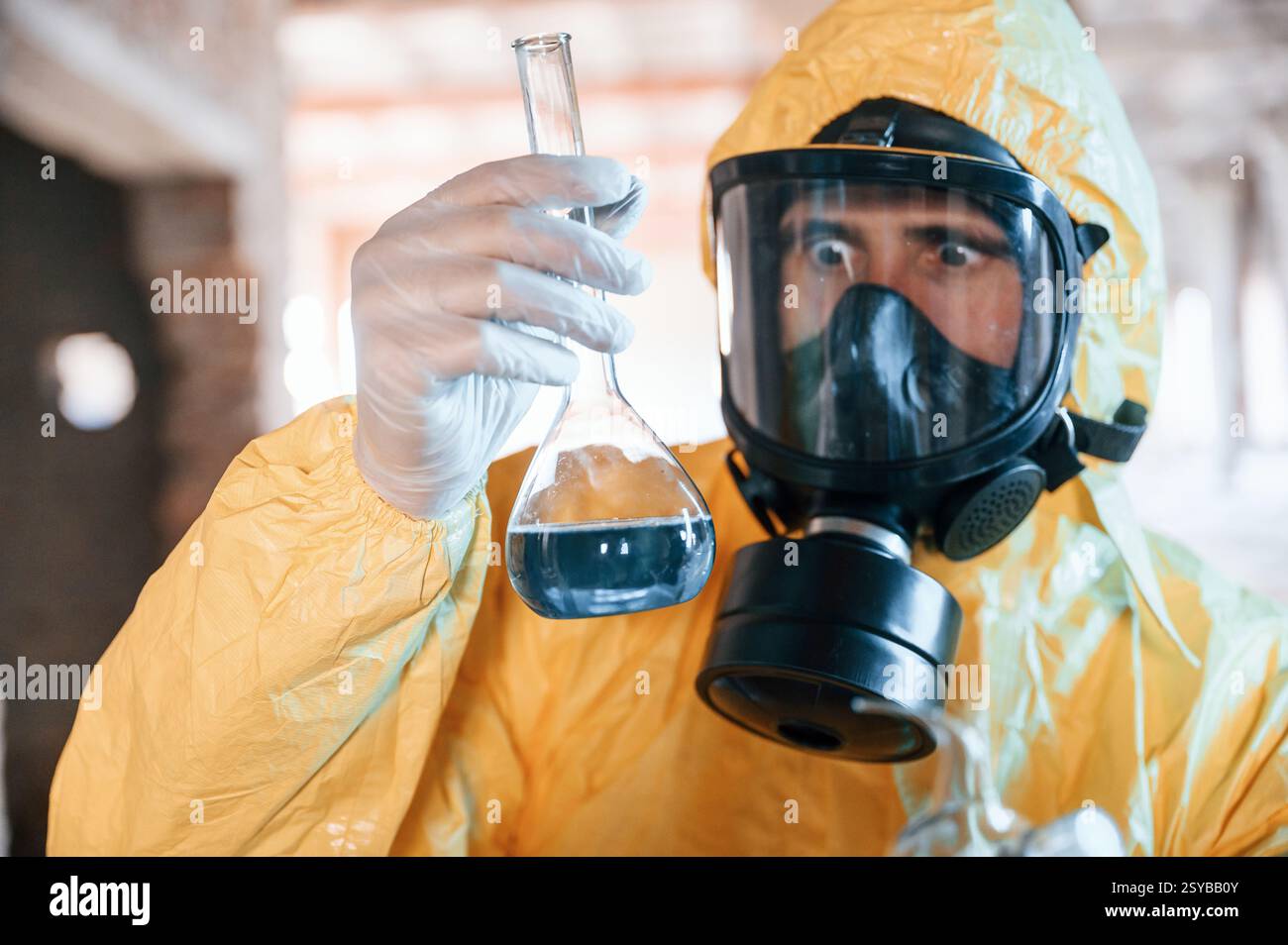 Frightened scientist is with radioactive materials. Man dressed in ...