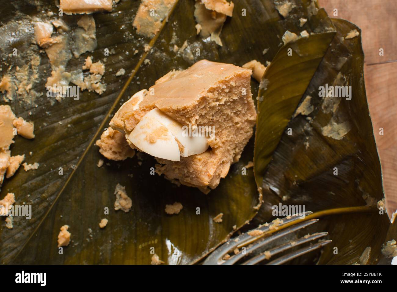 Overhead of moi moi in leaf on a plate, top view of nigerian bean ...