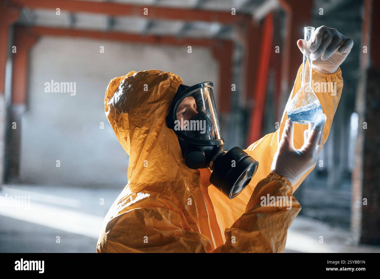 Examining radioactive liquid man hi-res stock photography and images ...