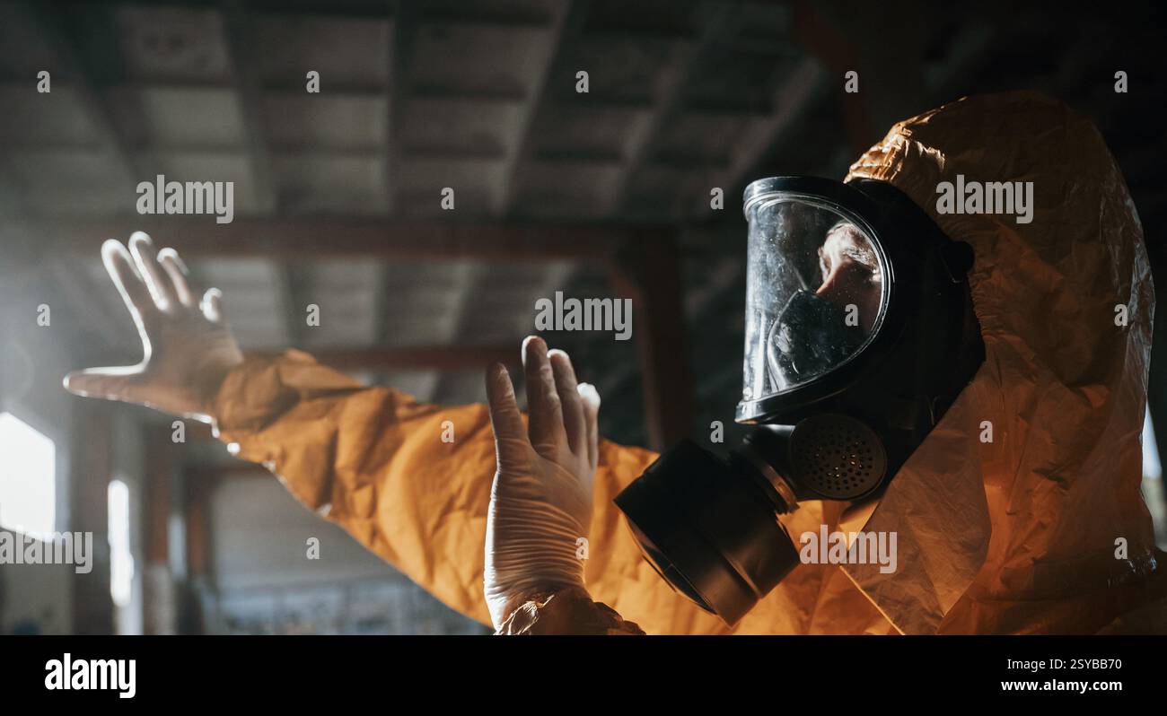 Light from nuclear explosion. Man dressed in chemical protection suit ...