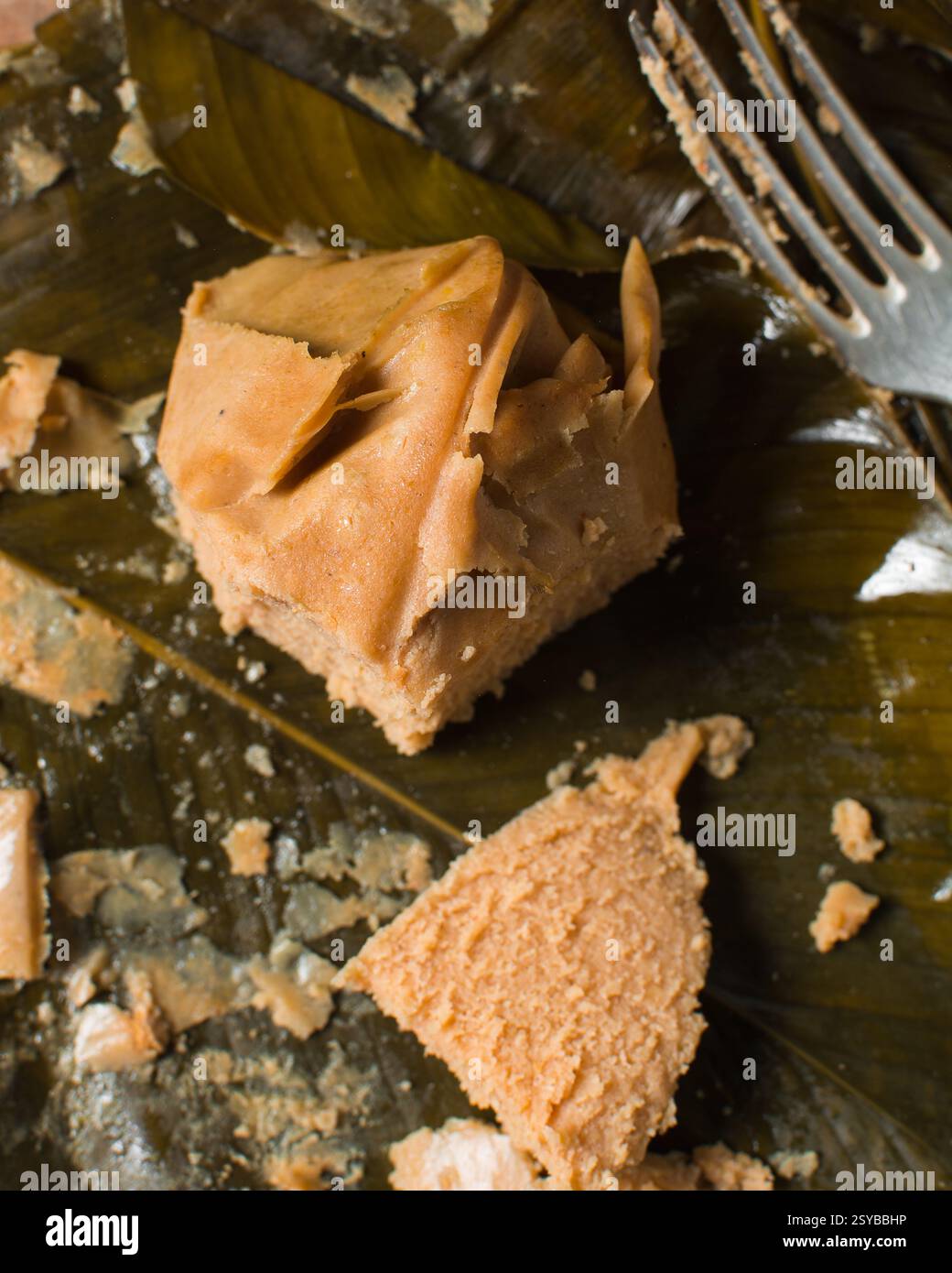 Overhead of moi moi in leaf on a plate, top view of nigerian bean ...