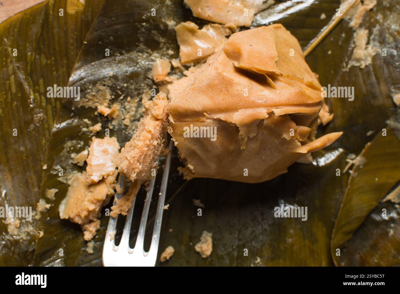 Overhead of moi moi in leaf on a plate, top view of nigerian bean ...