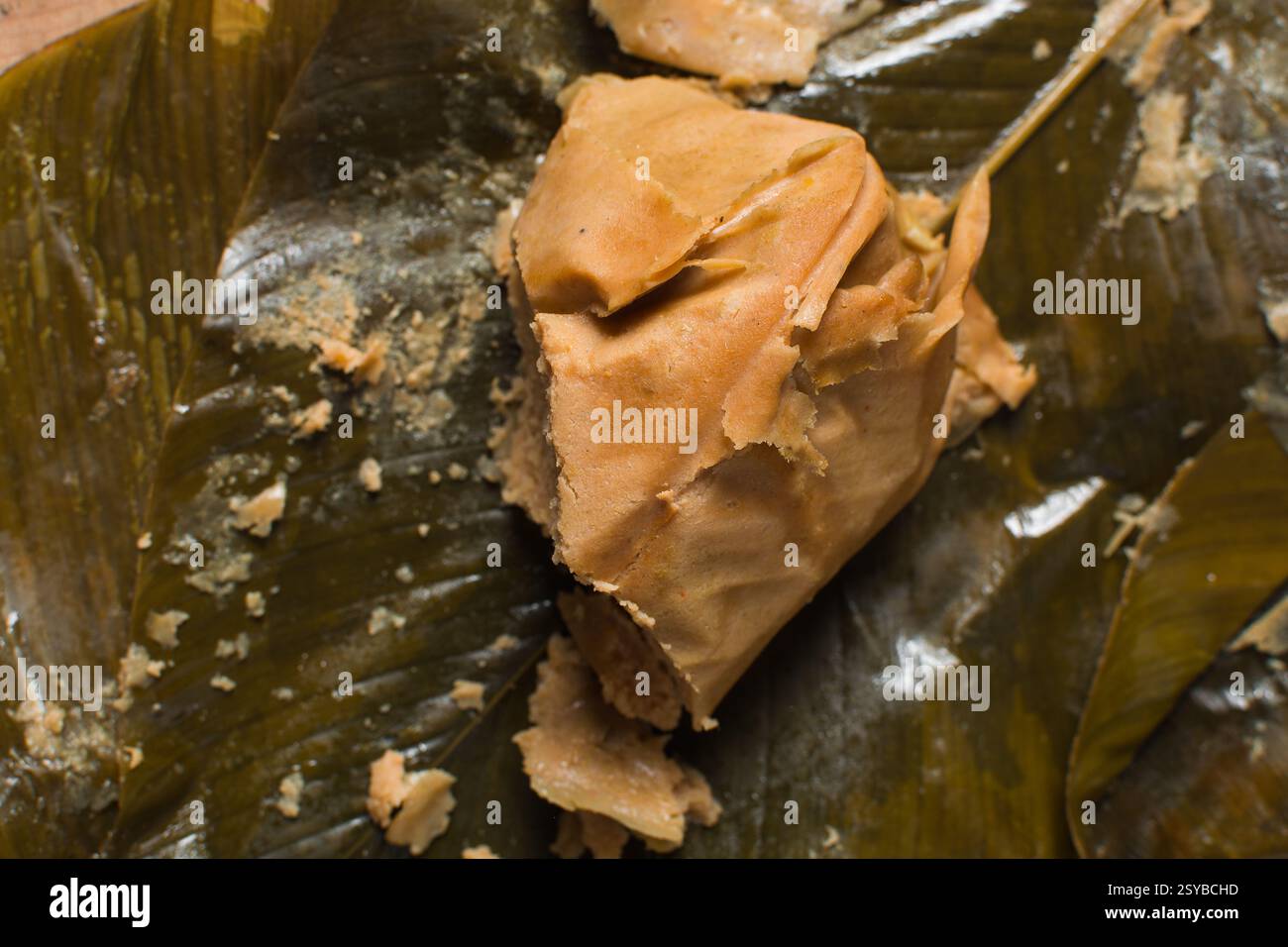 Overhead of moi moi in leaf on a plate, top view of nigerian bean ...