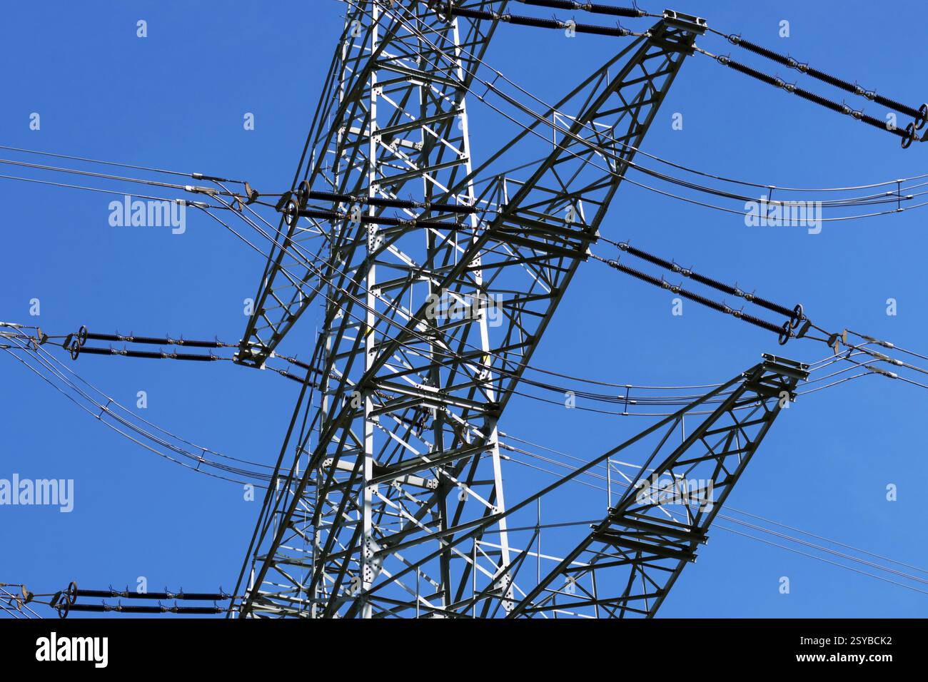 High-voltage line, electricity pylon in front of blue sky, energy ...