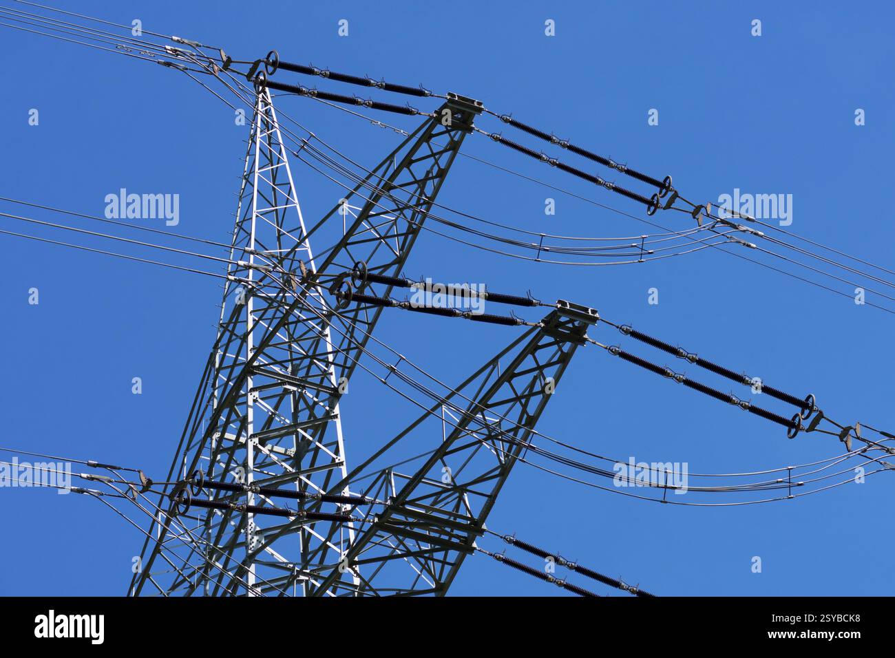 High-voltage line, electricity pylon in front of blue sky, energy ...