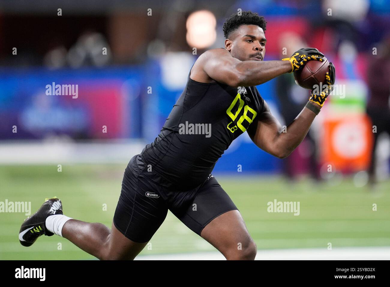 Iowa linebacker Jay Higgins runs a drill at the NFL football scouting ...