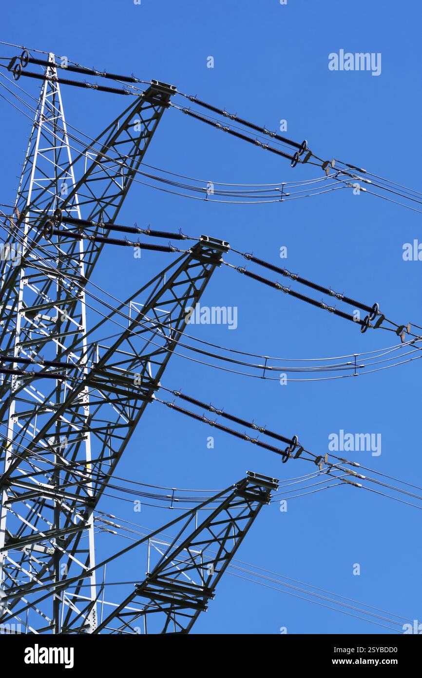 High-voltage line, electricity pylon in front of blue sky, energy ...